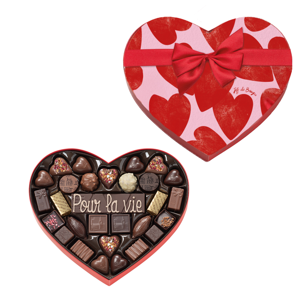 Pink heart-shaped box of Valentine's Day chocolates with dark chocolate ...