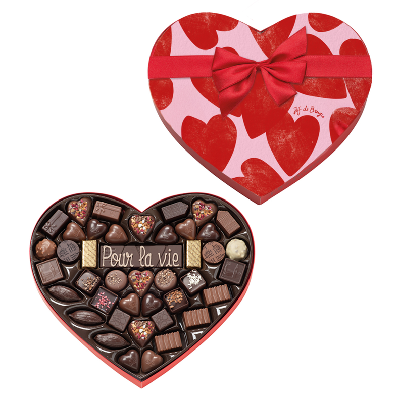Large pink heart-shaped of Valentine's Day chocolates box with dark ...