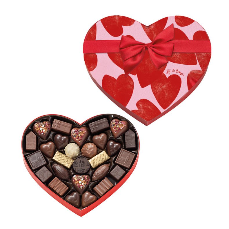 Small pink heart-shaped box of Valentine's Day chocolates