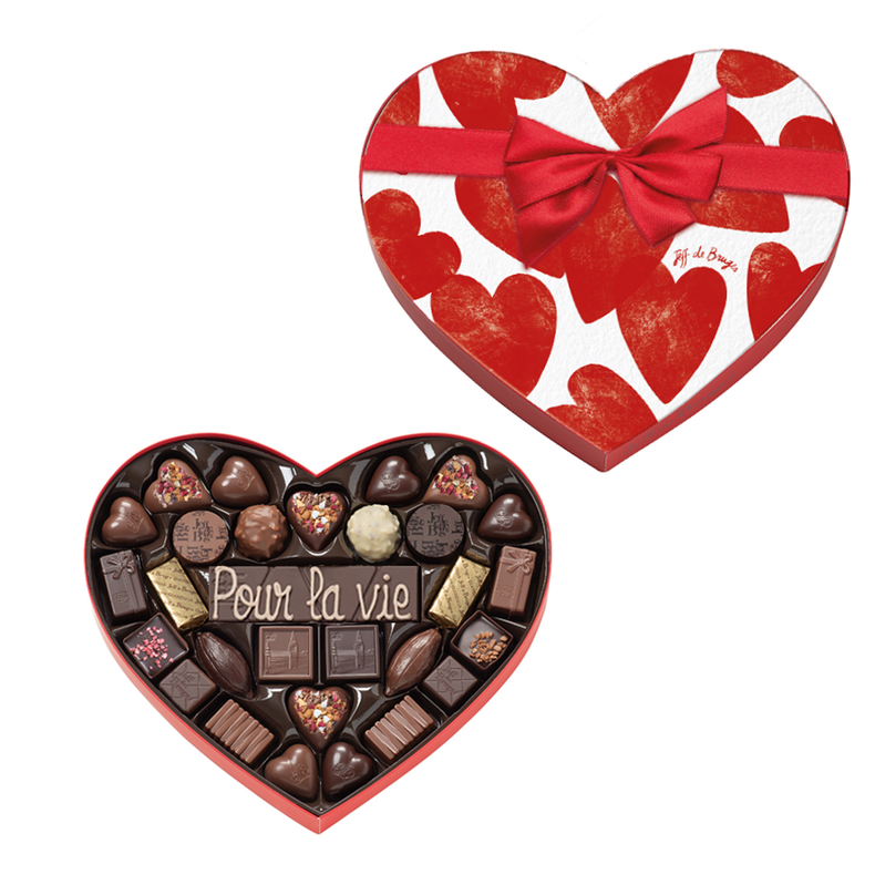 White heart-shaped box of Valentine's Day chocolates with dark ...